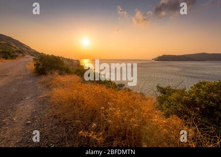Sunrise on the island of Crete near Spinalonga with sea coast, rocks ...
