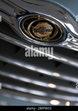 Chrysler badge mounted on the front of a car Stock Photo - Alamy