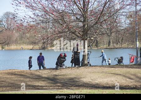 People practice social distancing during a news conference with ...