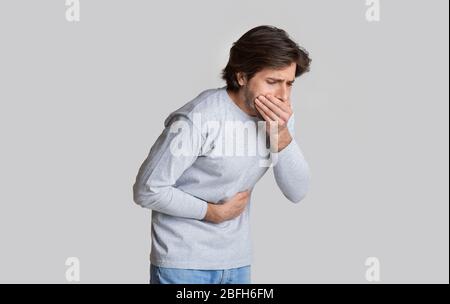 Nausea and stomach pain concept, free space Stock Photo - Alamy