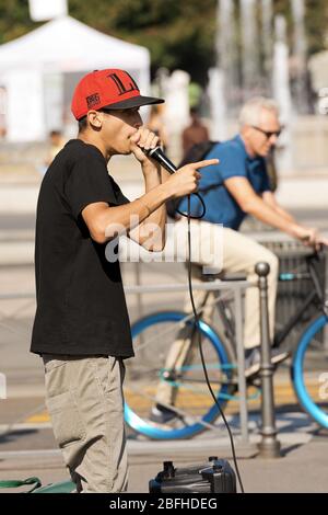 A boy beatbox performs in a street of the city center of Milan. The ...