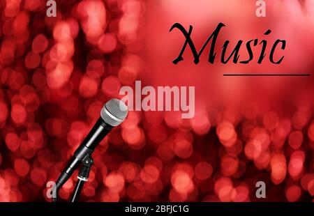 microphone on a bright red background Stock Photo - Alamy