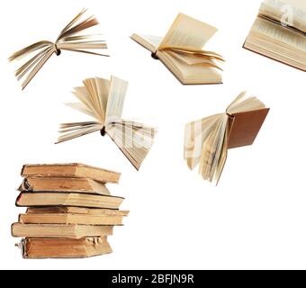 stack of flying books isolated on white background Stock Photo - Alamy