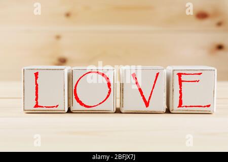 Love spelled in wooden blocks Stock Photo - Alamy