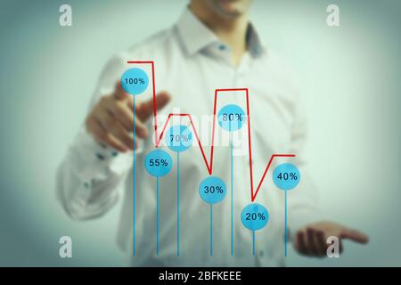 Businessman with financial graphic coming from hand Stock Photo - Alamy
