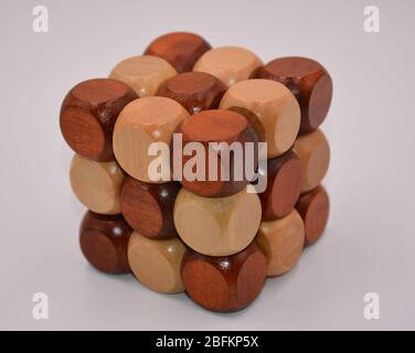The brown magic cubes made of wood with white background Stock Photo ...