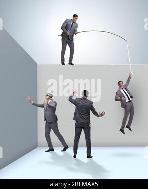 Businessman fishing his colleague in business concept Stock Photo - Alamy
