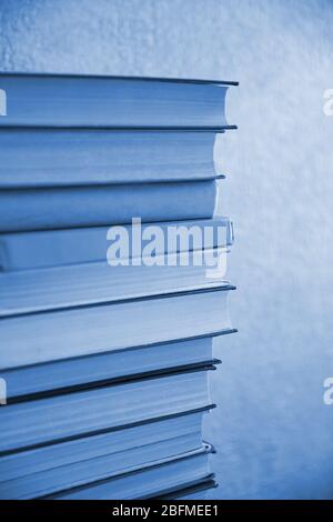 Row of books. Toned in blue Stock Photo - Alamy