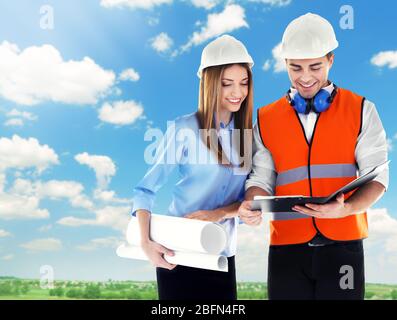 Two architects on sky background Stock Photo - Alamy