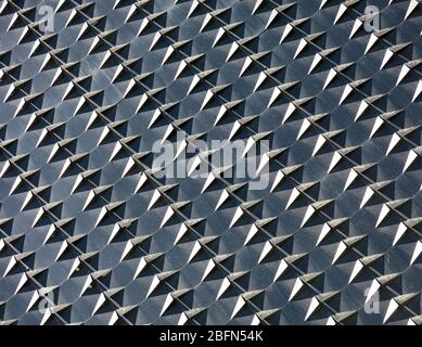 Photograph of a building facade with a repetitive pattern of windows in Casablanca, Casablanca ...