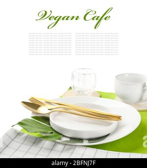 Table setting and text VEGAN CAFE on white background Stock Photo - Alamy