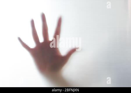 Diffused silhouette of female hands through plastic Stock Photo - Alamy