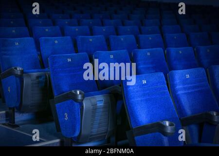 Comfy blue seats in empty cinema hall Stock Photo - Alamy