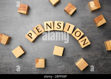 Cubes with word PENSION on grey background Stock Photo - Alamy