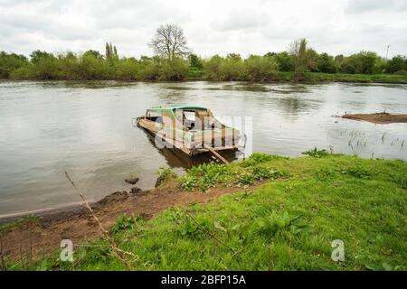 Small river boat sunk during floods Stock Photo - Alamy