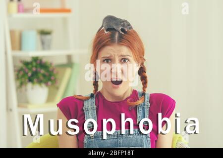 Terrified woman with mouse at home. Musophobia concept Stock Photo - Alamy