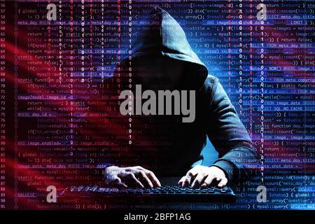 Professional hacker on dark background Stock Photo - Alamy