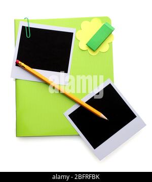 Photo papers and green notebook isolated on white Stock Photo - Alamy