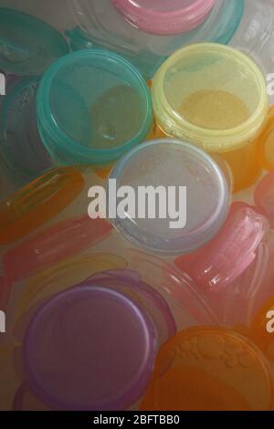 Plastic containers of different shapes and colors Stock Photo - Alamy