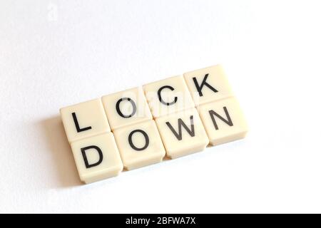 Lock down - Covid-19 - Scrabble letters - dark background Stock Photo ...