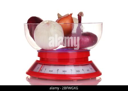 different types of onions in a kitchen scales isolated on white Stock ...