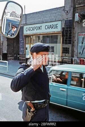8/19/1982 - A security policeman, salutes a passing vehicle at ...
