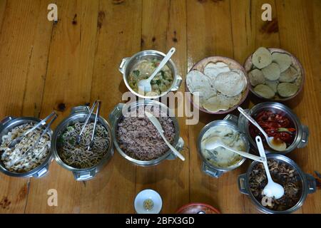 A Bhutanese farmhouse meal of handmade buckwheat noodles, potato curry ...