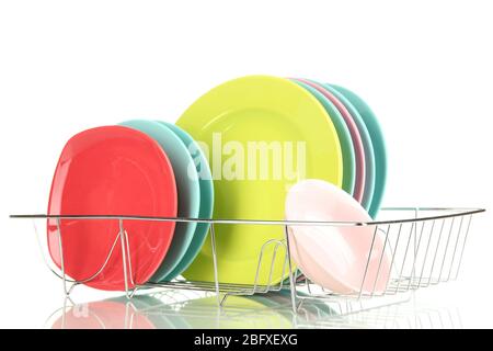 Color plates in rack isolated on white Stock Photo - Alamy