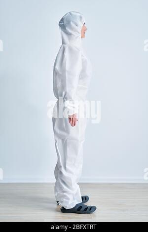 Woman in bio-hazard suit and face shield on white background Stock ...