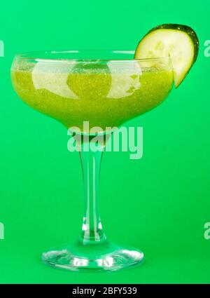Green vegetable juice in coctail glass on light background Stock Photo ...