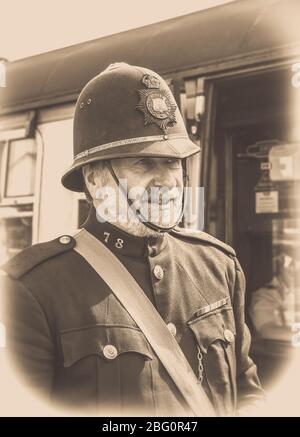 Close up of 1940s policeman in vintage police uniform & helmet sitting ...