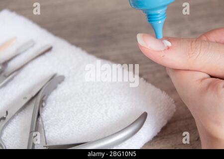 Apply the cream to the wound on the cuticle. The wound after a manicure ...