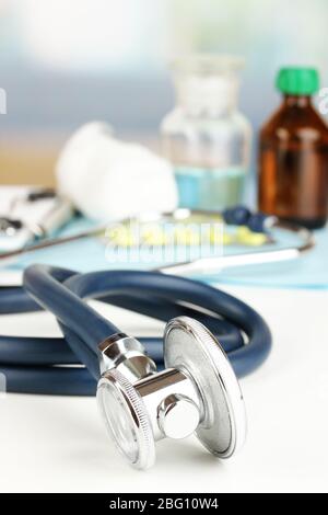 Stethoscope, heart and pills lying on the table Stock Photo - Alamy