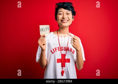 Young beautiful asian lifeguard girl wearing t-shirt with red cross ...