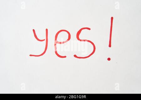 The inscription YES in red marker on a white sheet Stock Photo - Alamy