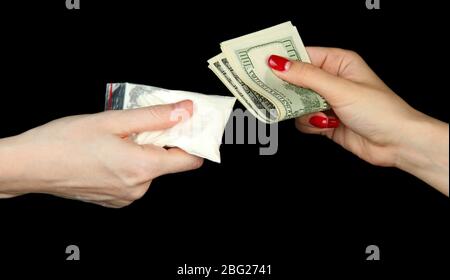 Dealer sells drug bag, isolated on black Stock Photo - Alamy