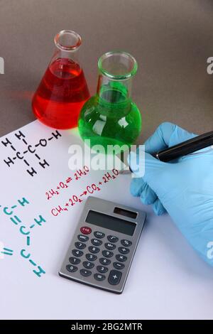 Hand scientist writing formulas Stock Photo - Alamy