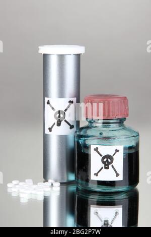 Deadly poison in bottles on black background Stock Photo - Alamy