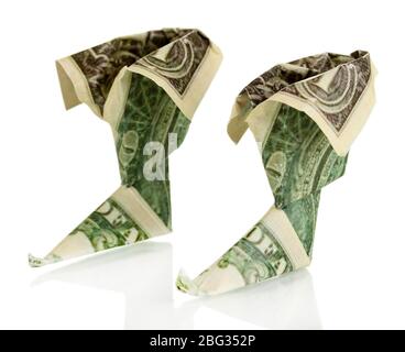 Dollar folded into boots isolated on white Stock Photo - Alamy