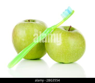 Apples with a toothbrush isolated on white Stock Photo - Alamy