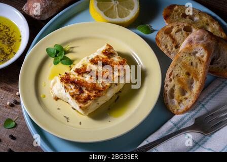 Grilled Greek haloumi cheese with herbs and spices Stock Photo - Alamy