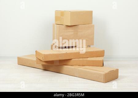 Different cardboard boxes in room Stock Photo - Alamy