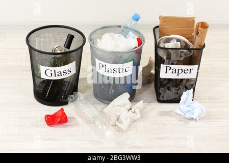 Three buckets of assorted debris on room background Stock Photo - Alamy