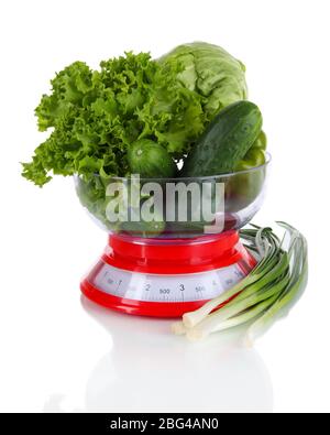 Fresh vegetables in scales isolated on white Stock Photo - Alamy