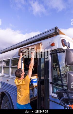 Old yellow school bus converted into a double decker camper Stock Photo ...