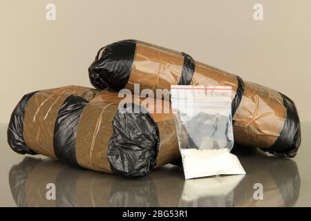 Packages of narcotics on gray background Stock Photo - Alamy