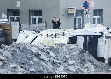 Riot police officers in formation rushing to arrest protesters during ...