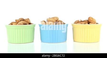 Almond in bowls, isolated on white Stock Photo - Alamy