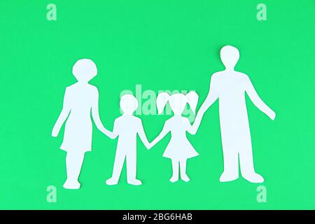 Family from paper on bright background Stock Photo - Alamy