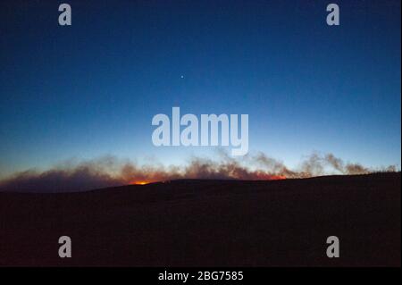 View of flames and smoke from a fire on Arthur's Seat in Holyrood Park ...